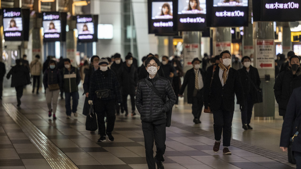 Japan expands virus emergency, tightens border restrictions